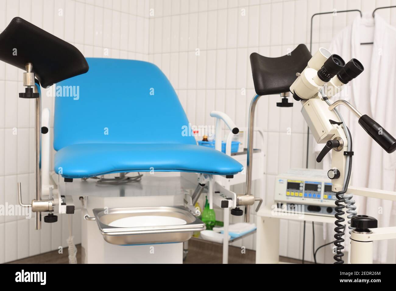 blue gynecological chair and colposcope close-up in a modern clinic ...