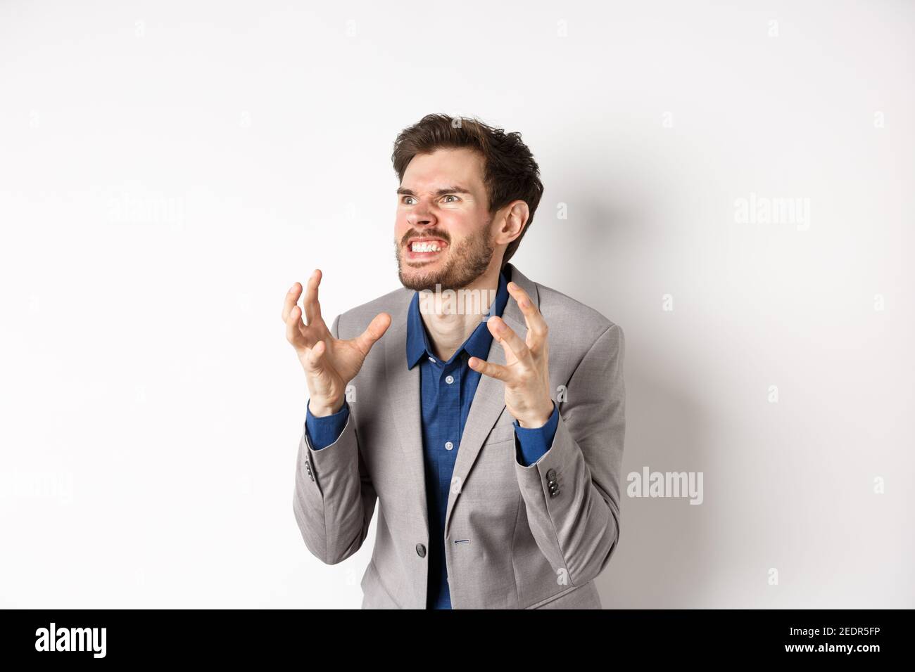Angry man in business suit look left with hatred, stare aside and ...