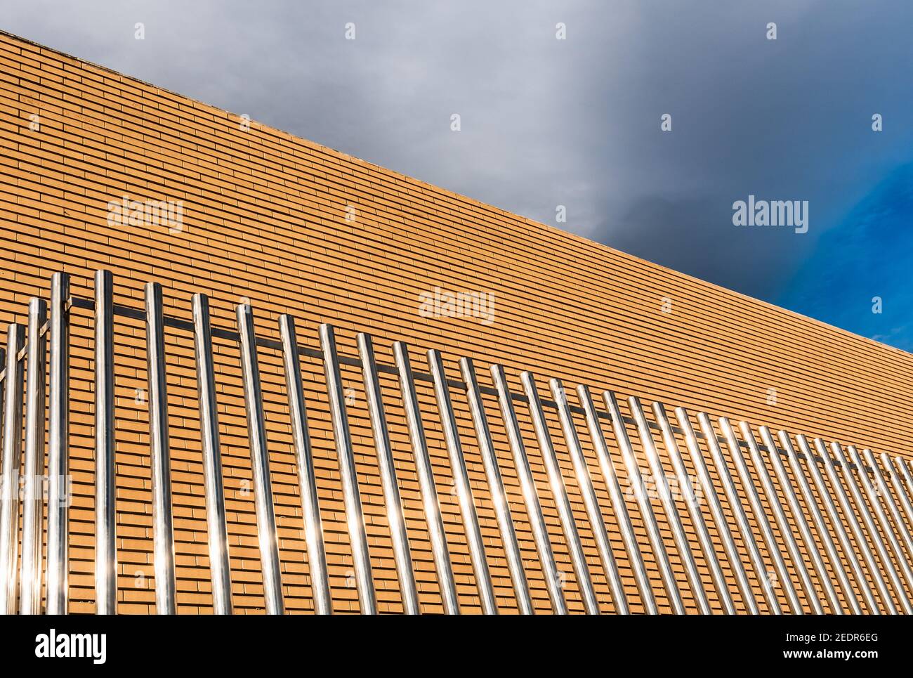 Thick metal bars protect a brick wall building Stock Photo - Alamy