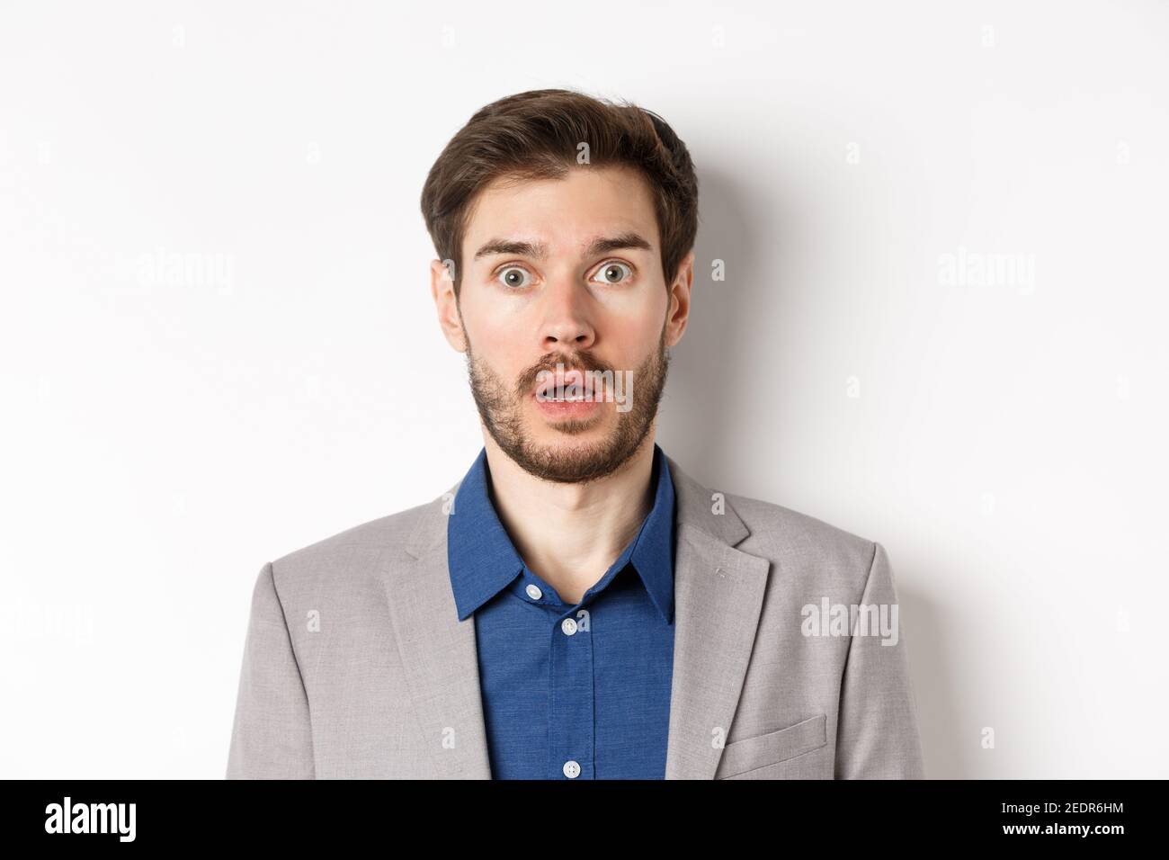 Close up portrait of shocked caucasian man in suit drop jaw, looking ...