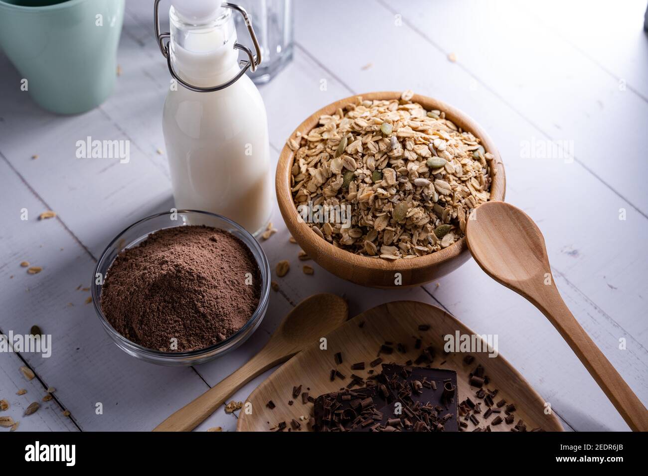 Cereal mix with seeds and nuts with chocolate and milk on the side ...