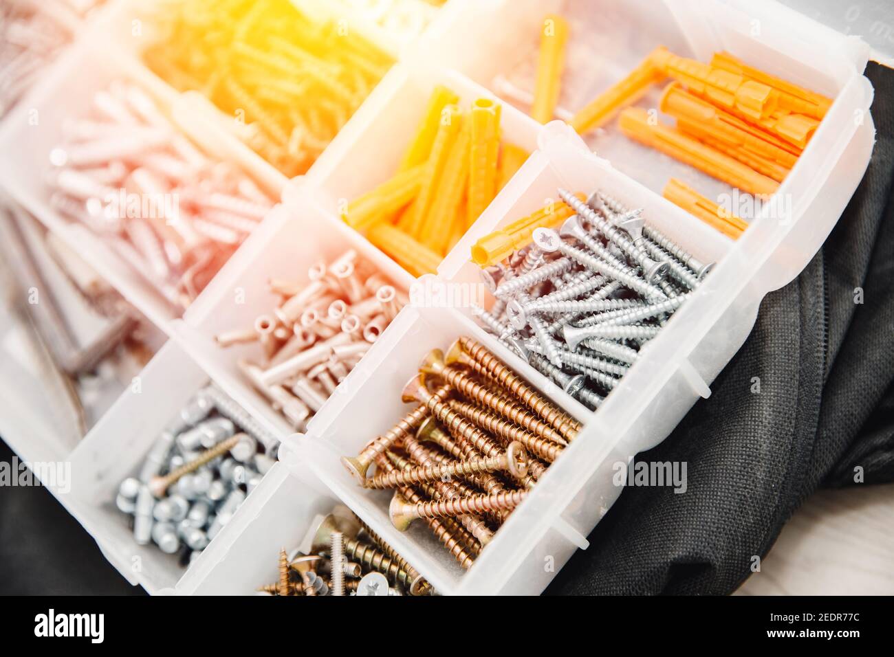 Case with small construction objects. Set metal tool box of screws ...