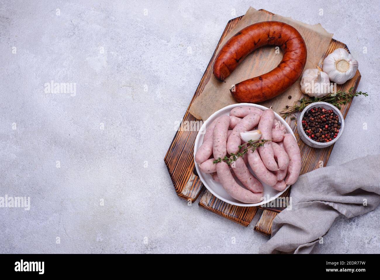 Raw uncooked sausages for grilled Stock Photo - Alamy