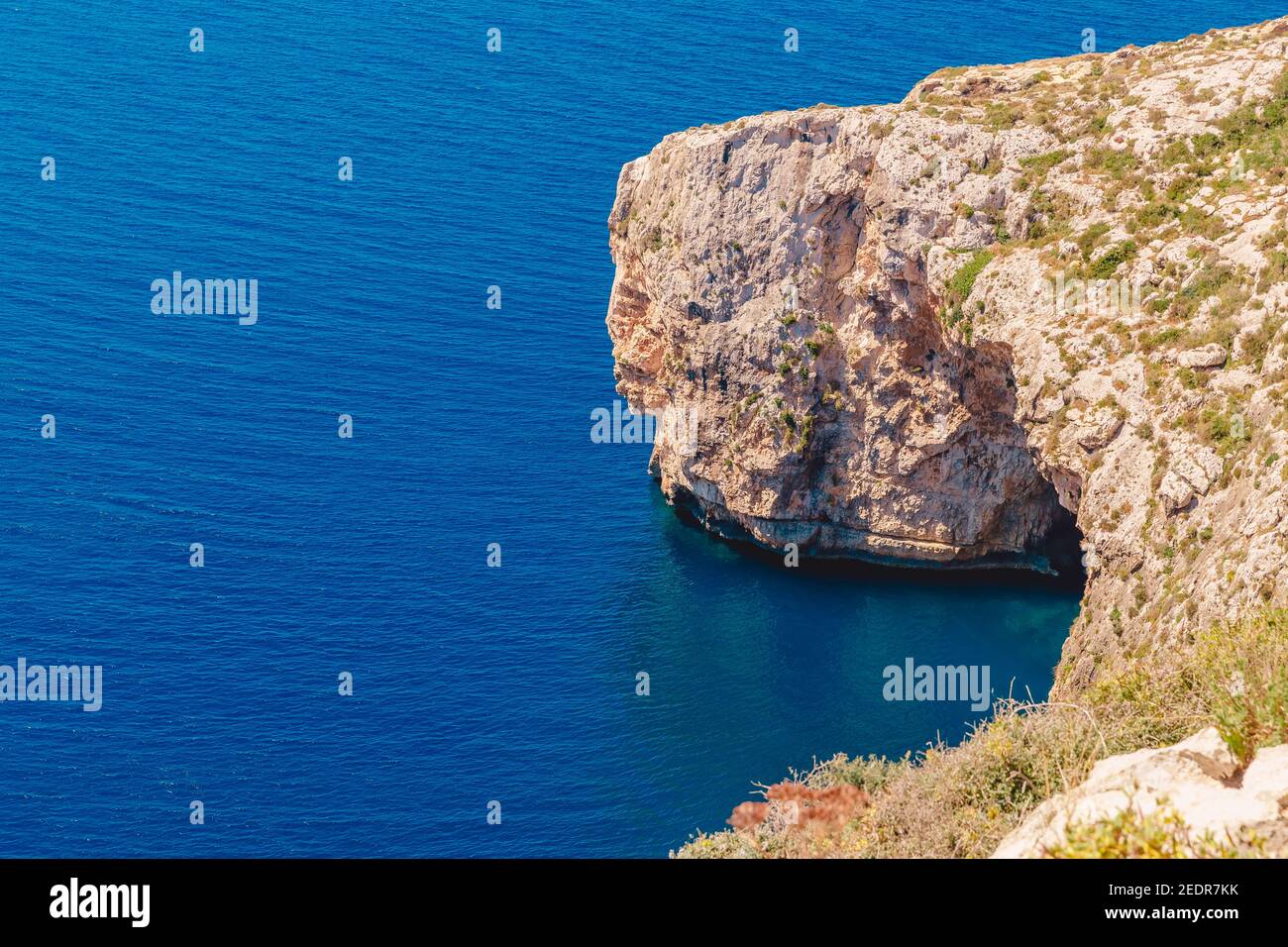 Blue Grotto in Malta. Pleasure boat with tourists runs. Natural arch ...