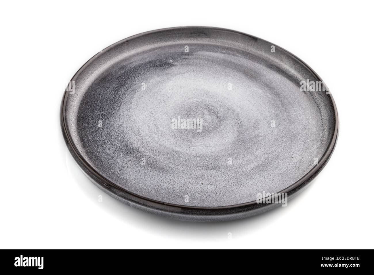 Empty gray ceramic plate isolated on white background. Side view, close ...