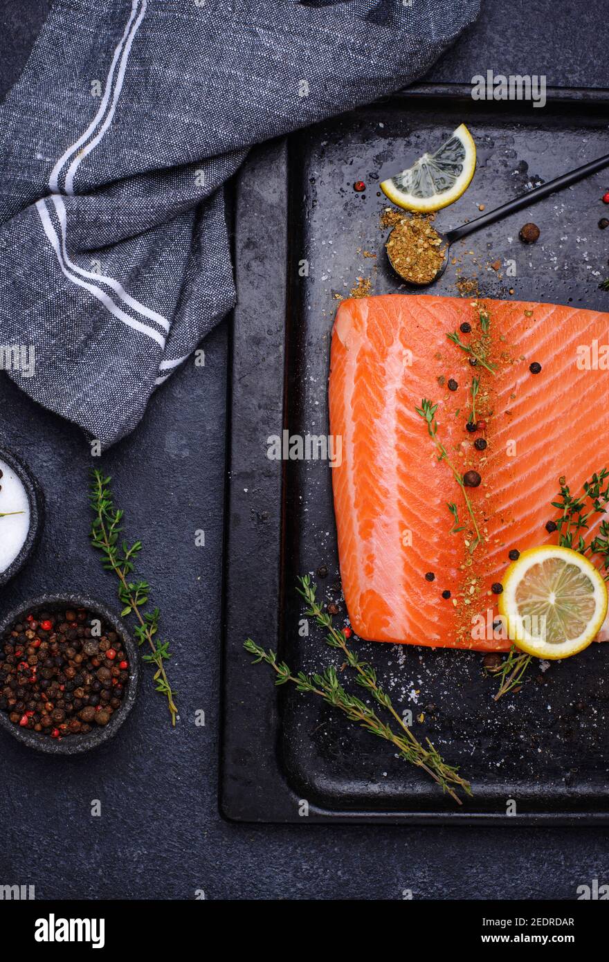 Raw salmon fillet with herbs Stock Photo - Alamy