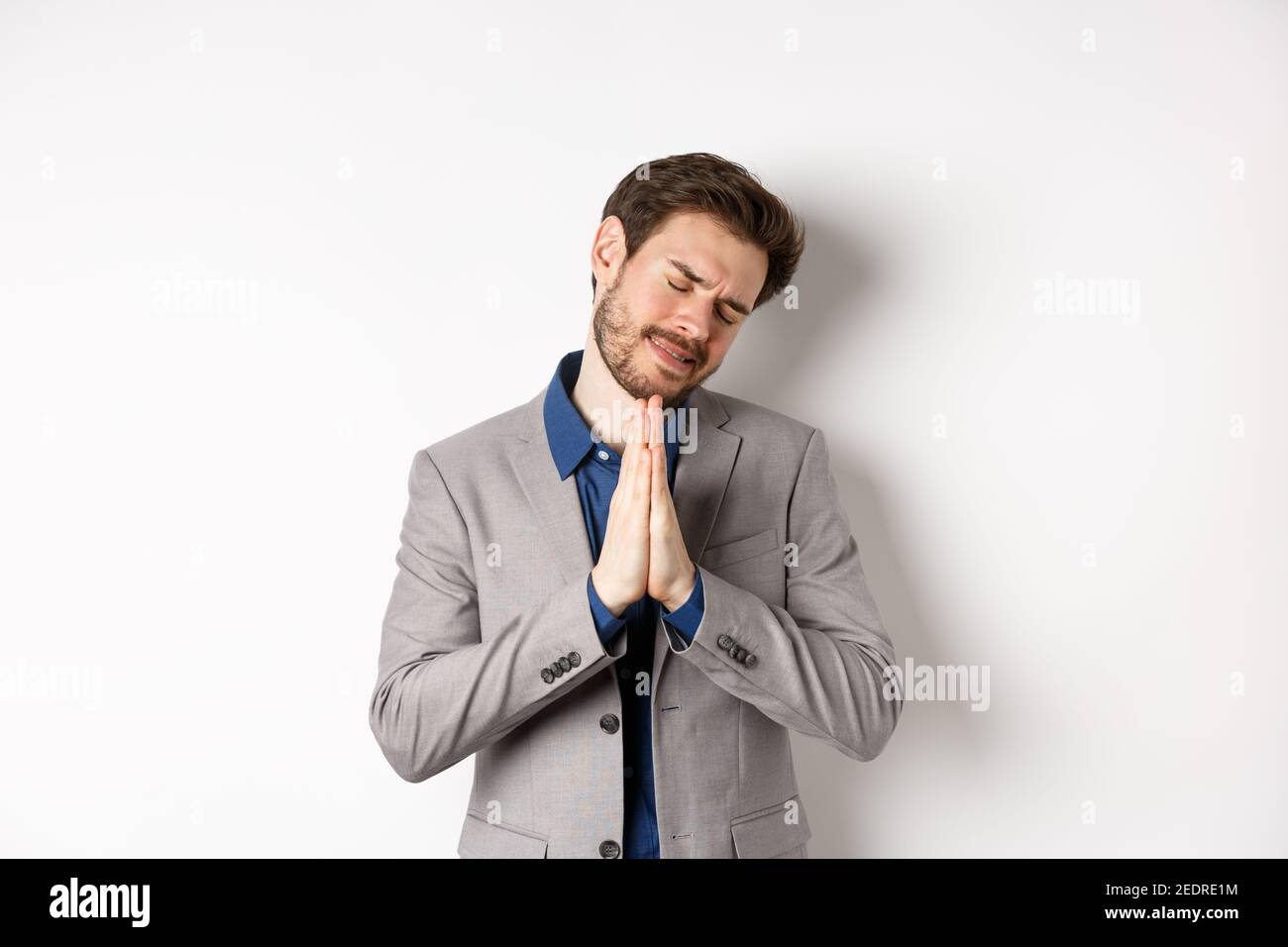 Pleading businessman begging for help, holding hands in pray and asking ...