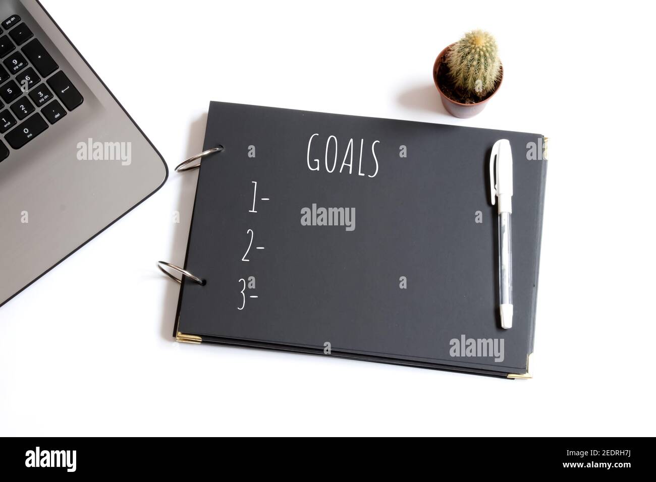 Top view notepad with goal list. New year plans concept. Goal setting ...