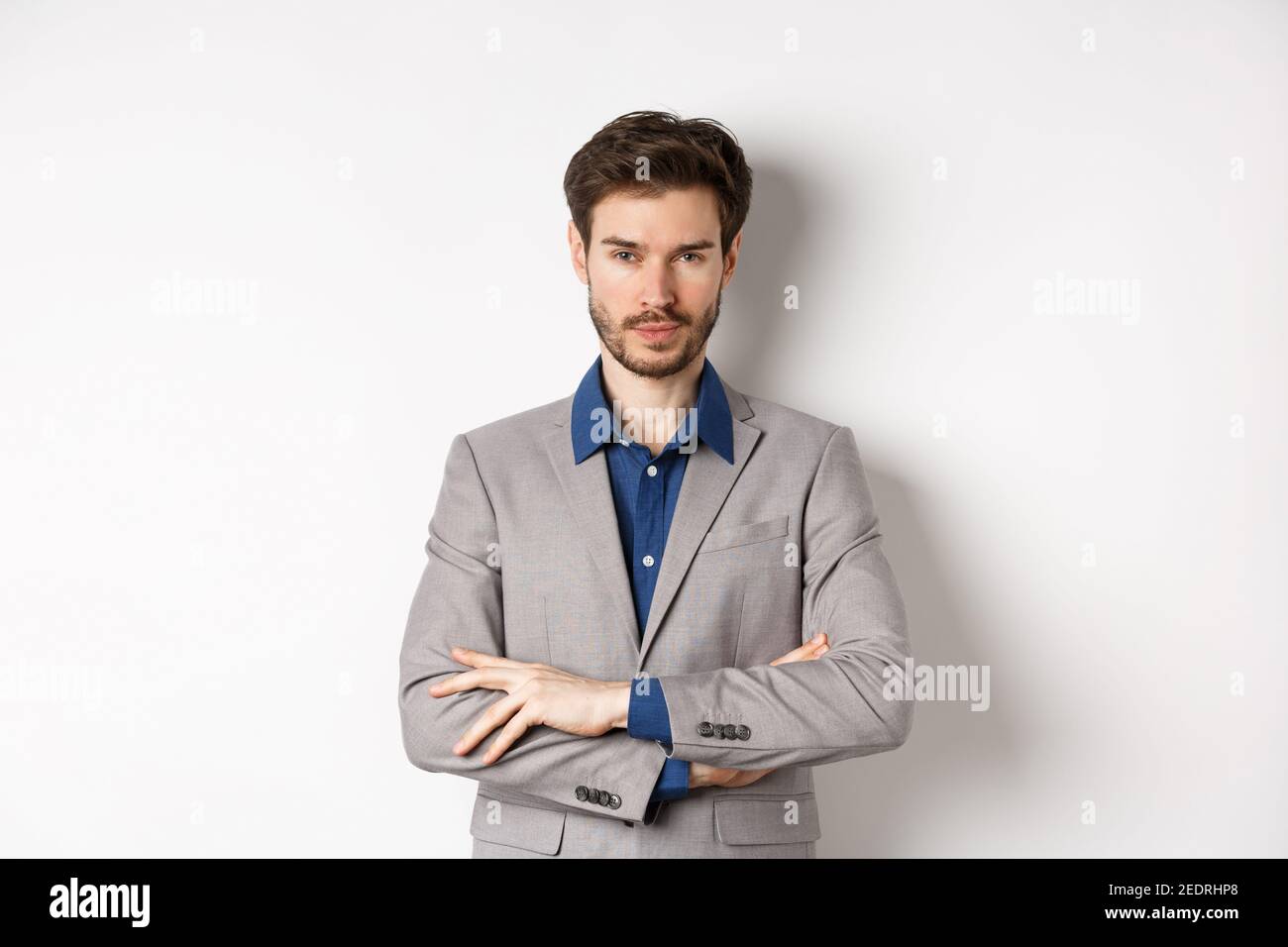 Confident young man looking like professional, cross arms on chest in ...