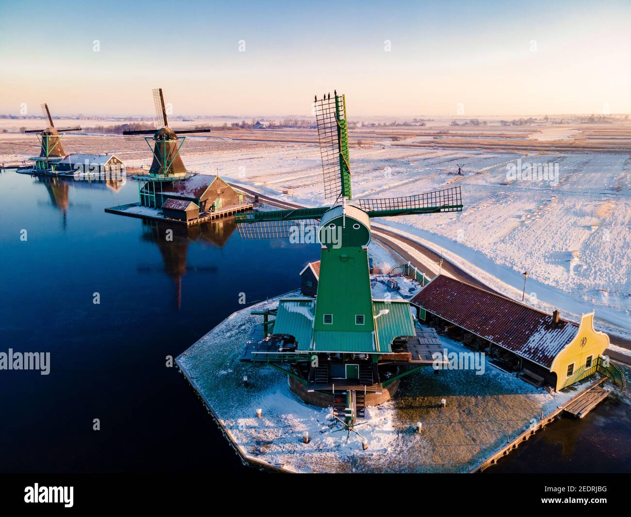 snow covered windmill village in the Zaanse Schans Netherlands ...