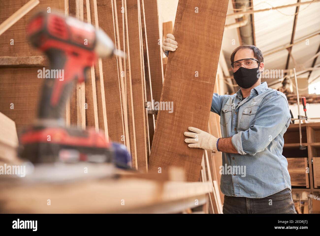 Craftsman as a carpenter with face mask because of Covid-19 in the ...