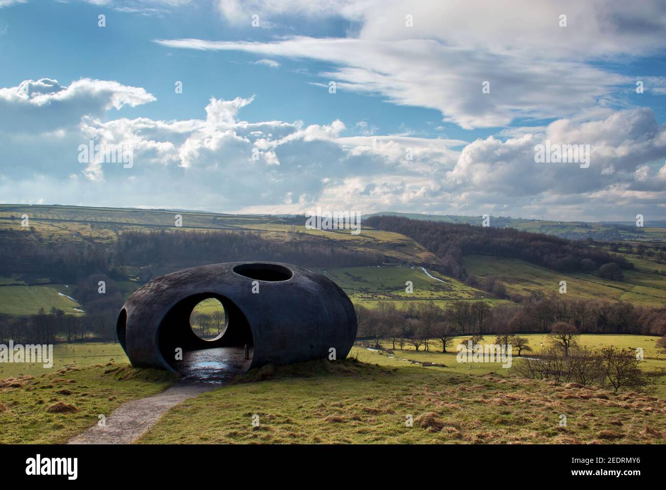 A view of the green fields of the Wycoller valley, in winter sun, with ...