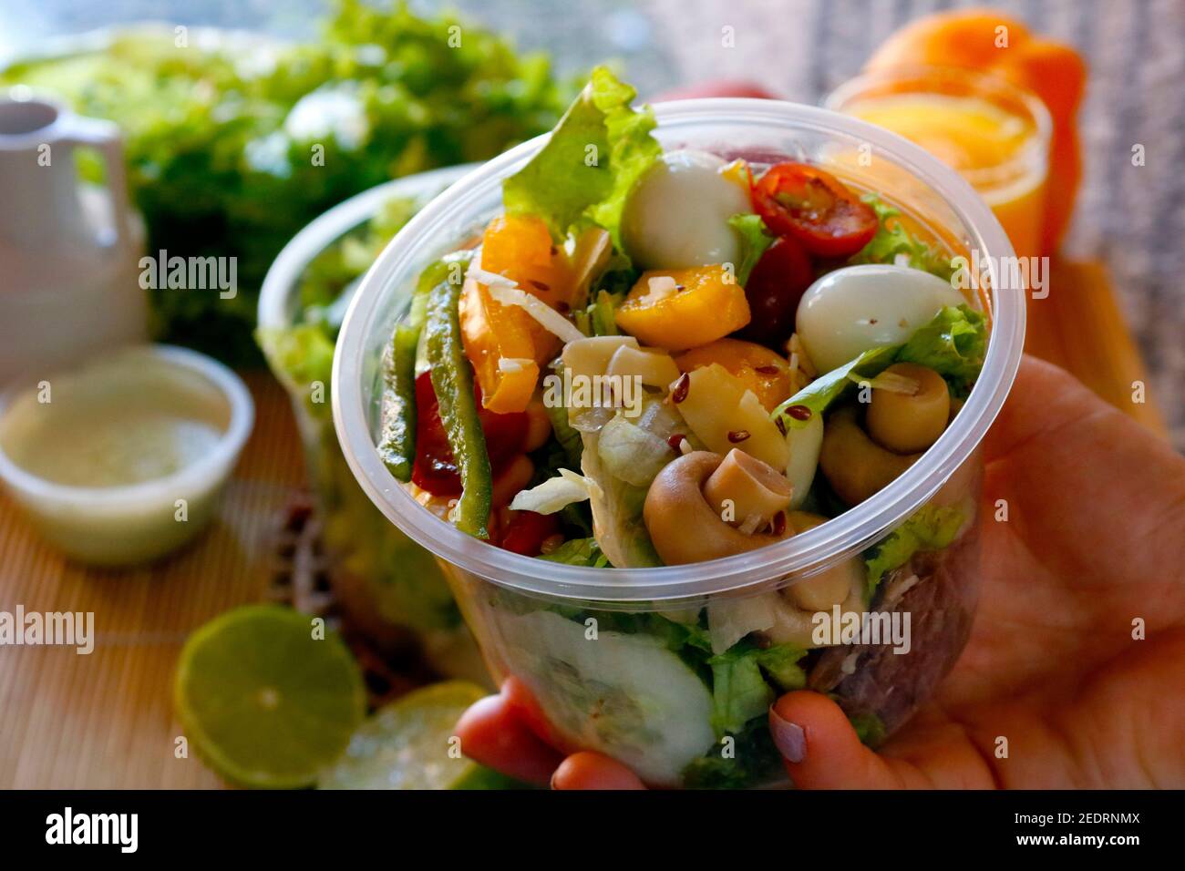 Fresh vegetable salad in an open plastic bowl packing Stock Photo - Alamy