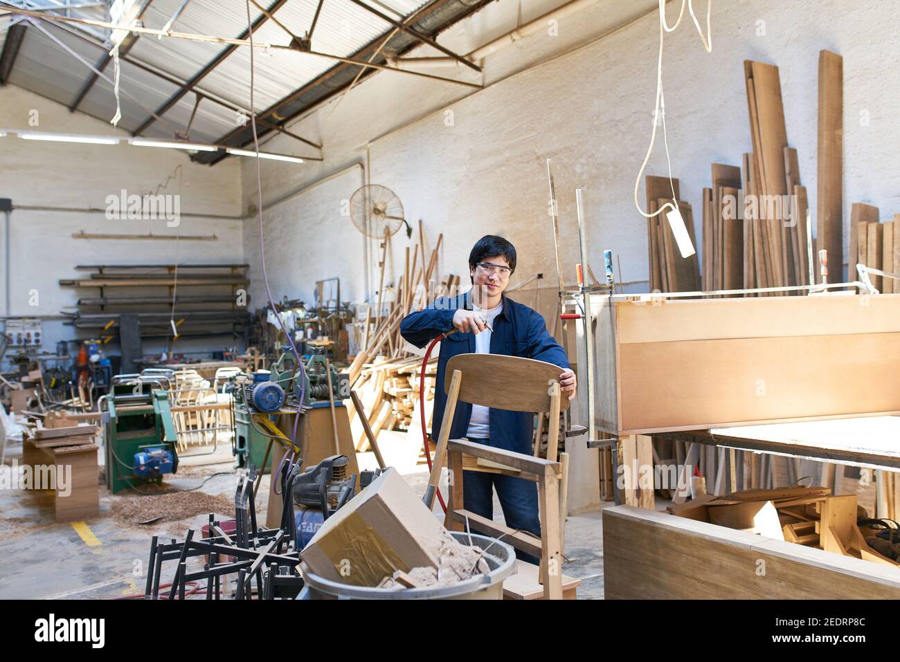 Craftsman as furniture maker and carpenter trainee in the joinery ...