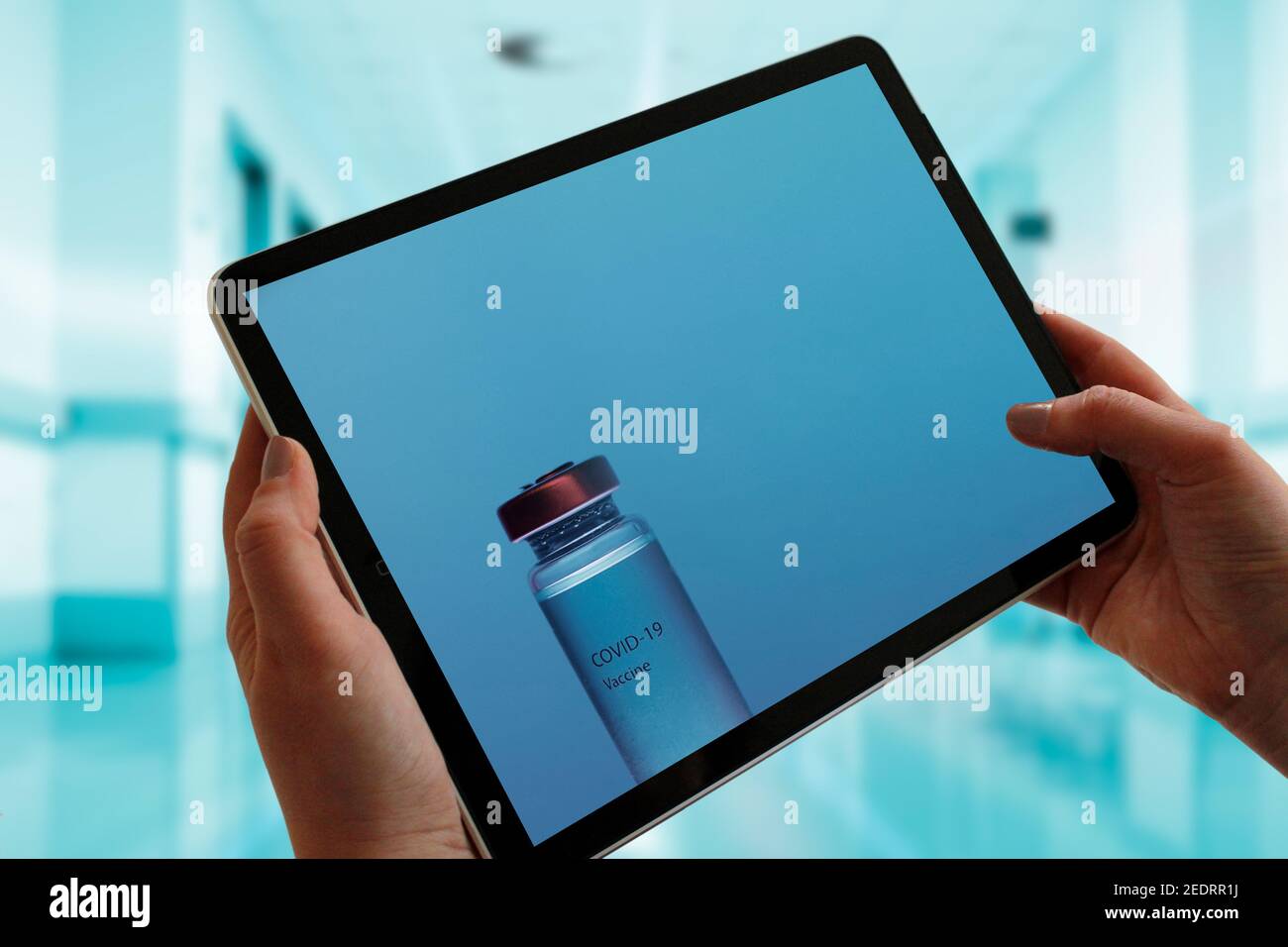 COVID-19 vaccine bottle on the screen of a tablet Stock Photo - Alamy