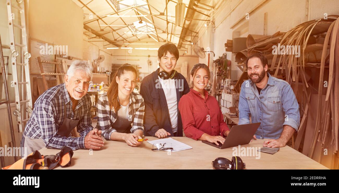 Group of apprentices and masters training to become craftsmen in a ...