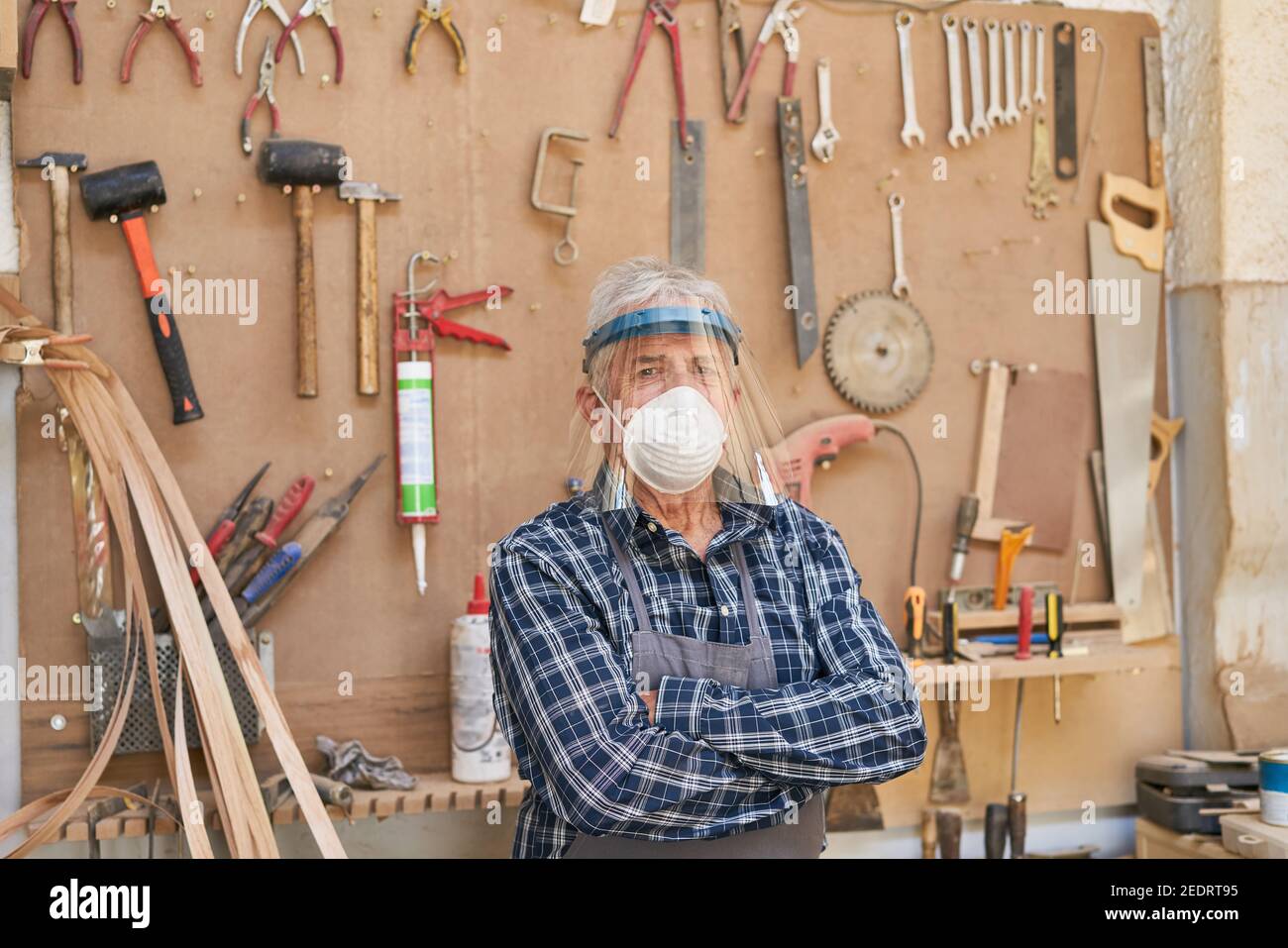 Senior craftsman face mask hi-res stock photography and images - Alamy
