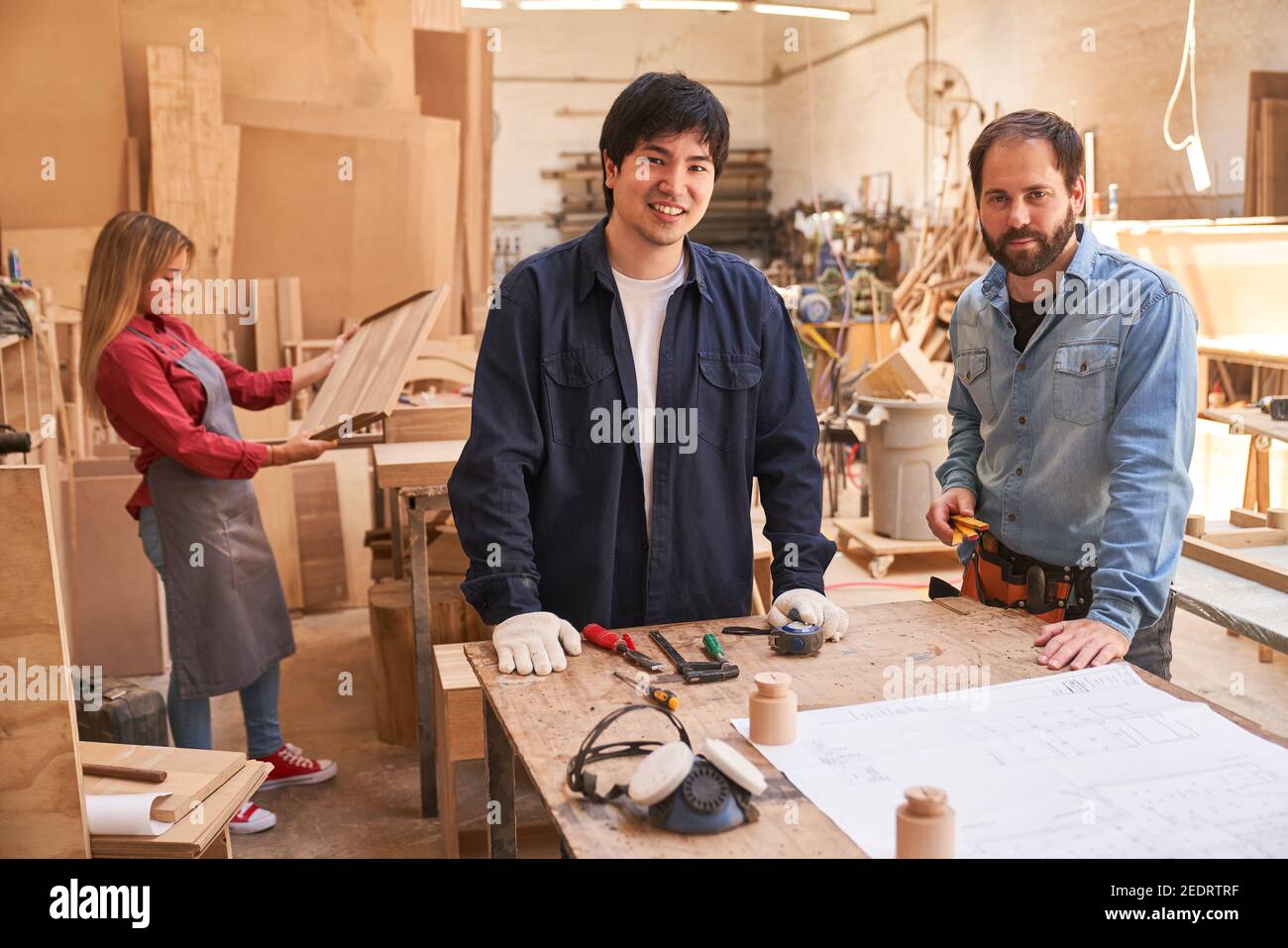 Craftsmen team with trainers and apprentices in the carpentry workshop ...