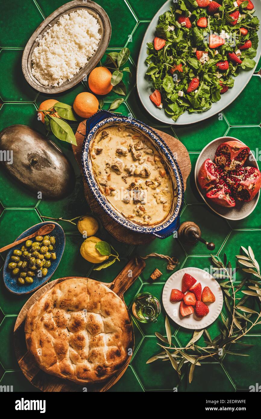 Turkish style family dinner. Flat-lay green tile table with Turkish ...