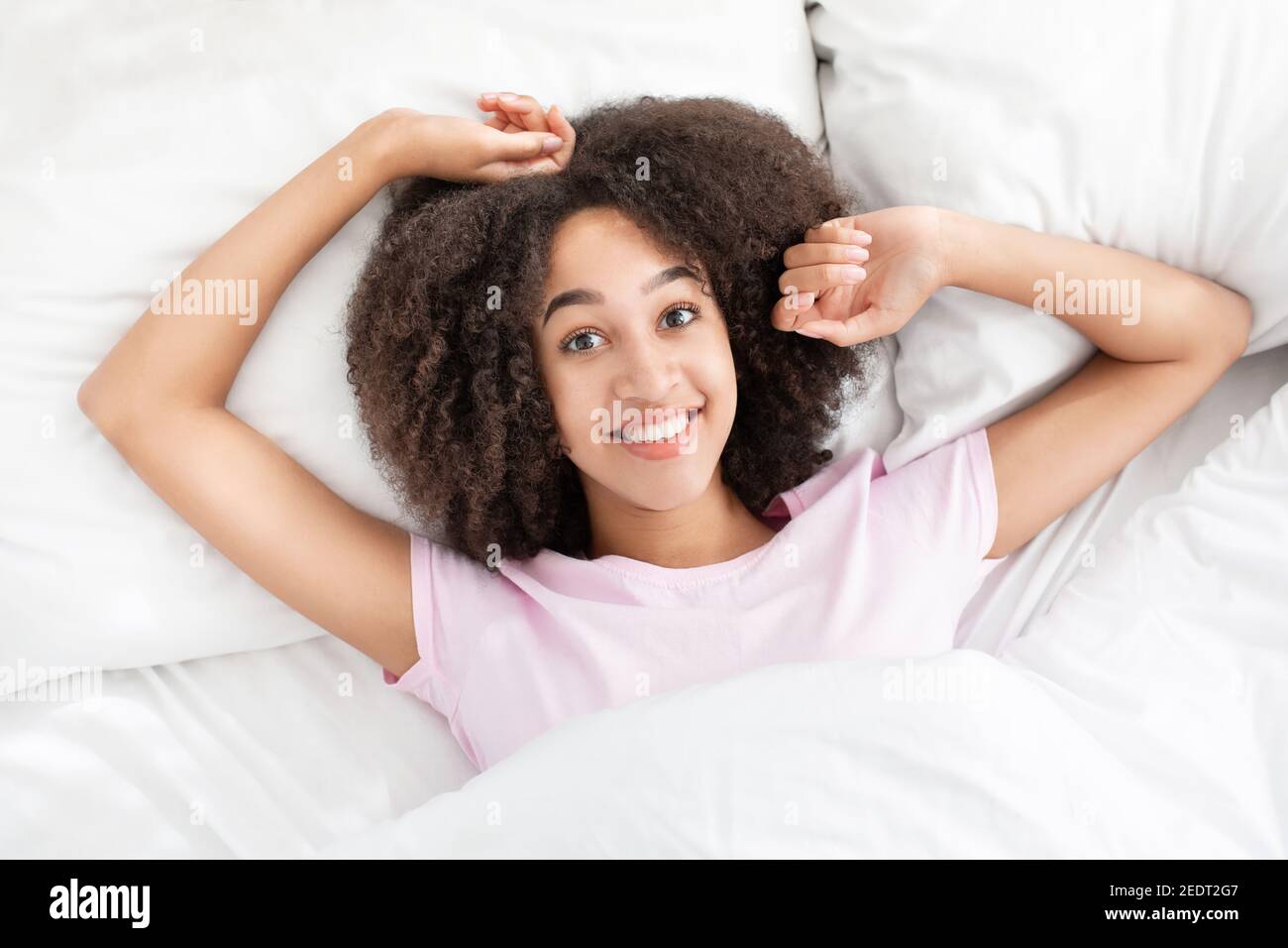 African american woman waking up in bed hi-res stock photography and ...