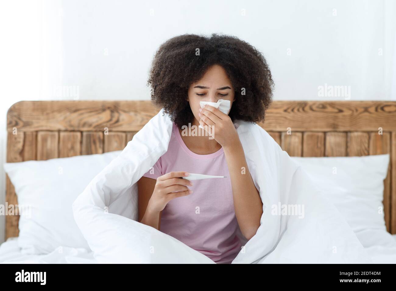 Sick woman suffers from throat and nose sore and ill from colds and flu in morning Stock Photo ...