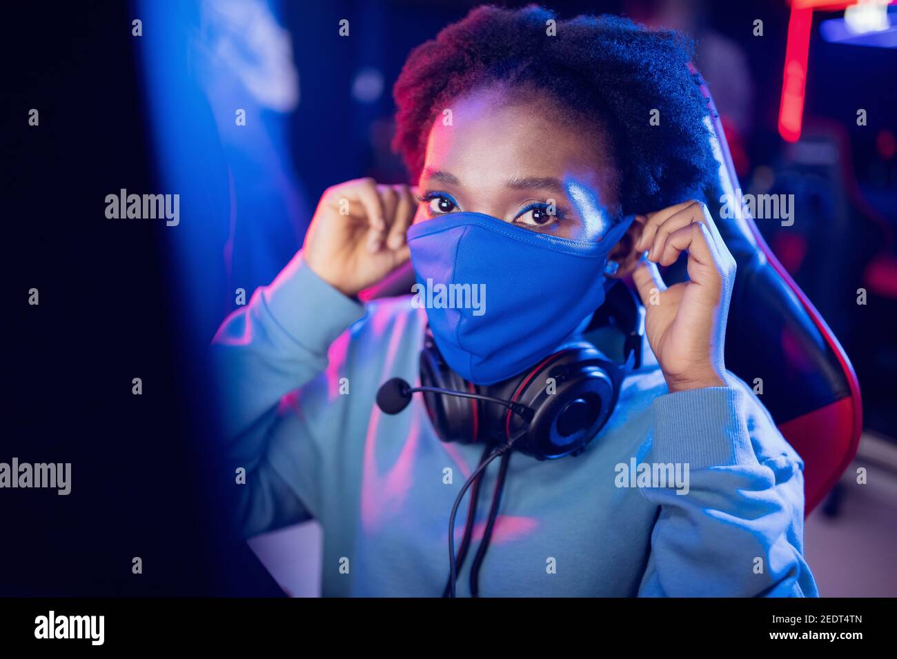 Streamer gamer African American young girl in protective mask ...