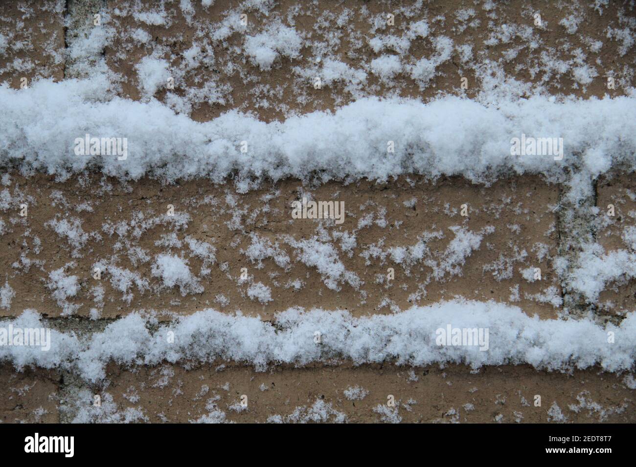 Chilling view of an old wall with snow Stock Photo - Alamy