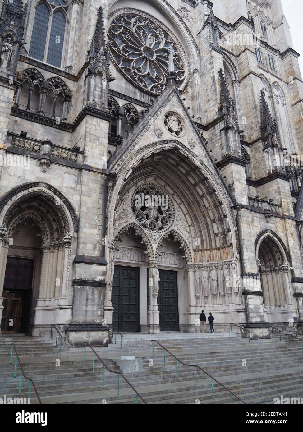 Vertical low angle shot of The Cathedral Church of Saint John the Divine in New York Stock Photo ...