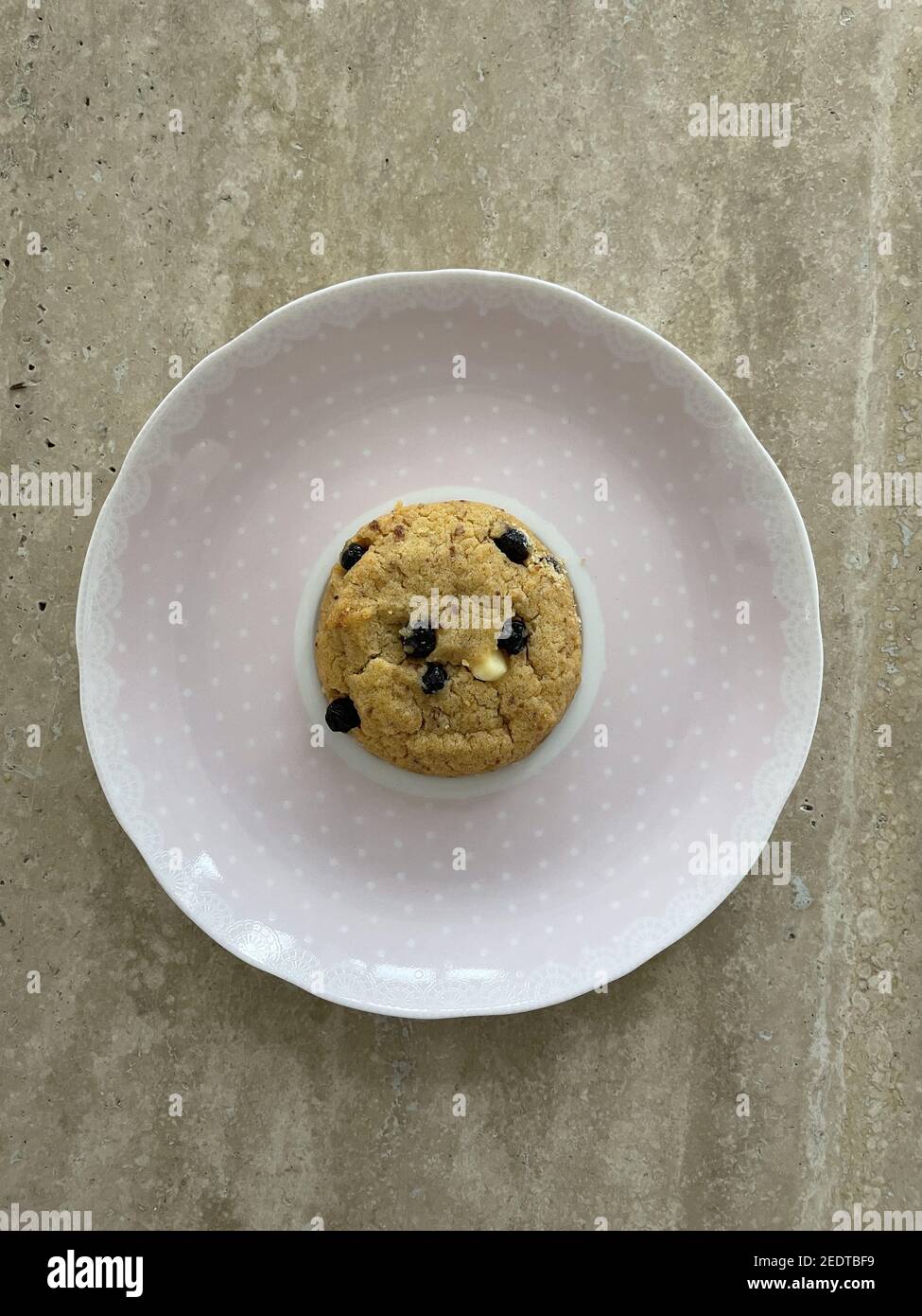 Vertical top view of chocolate chip cookie on a plate Stock Photo - Alamy