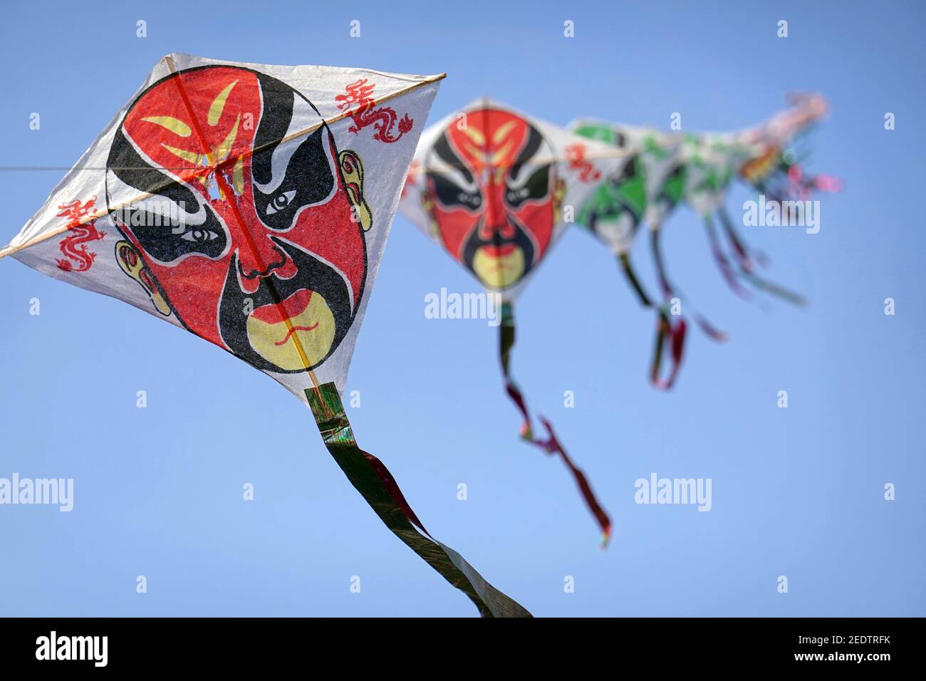 BEIJING, CHINA - FEBRUARY 15, 2021 - A Peking Opera mask kite flutters ...