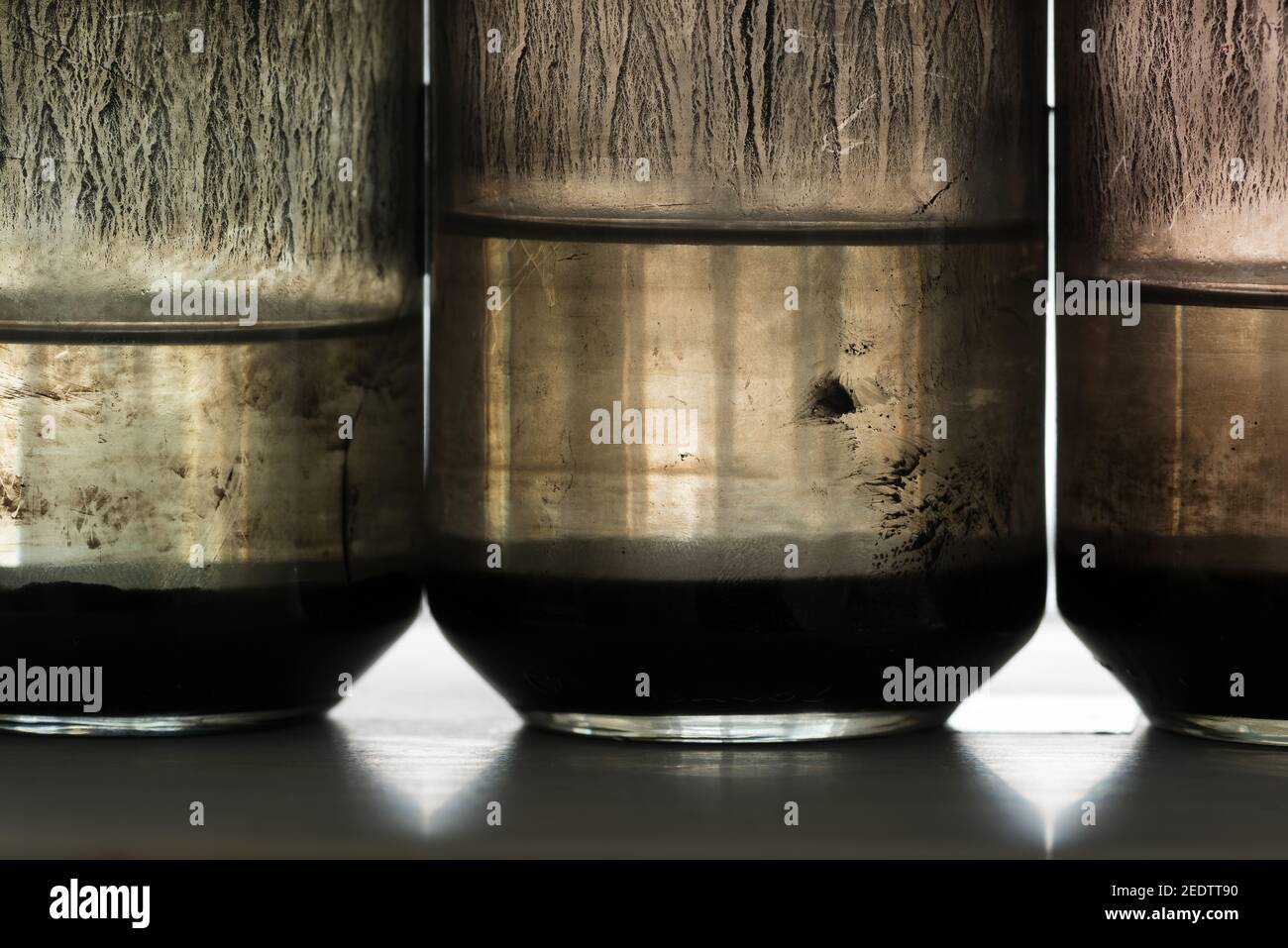 Sedimentation of tonal black oil pigment in organic solvent mineral oil ...