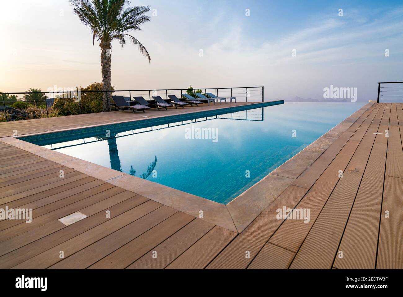 Infinity pool in a resort of arabian desert. Luxury resort in Oman ...