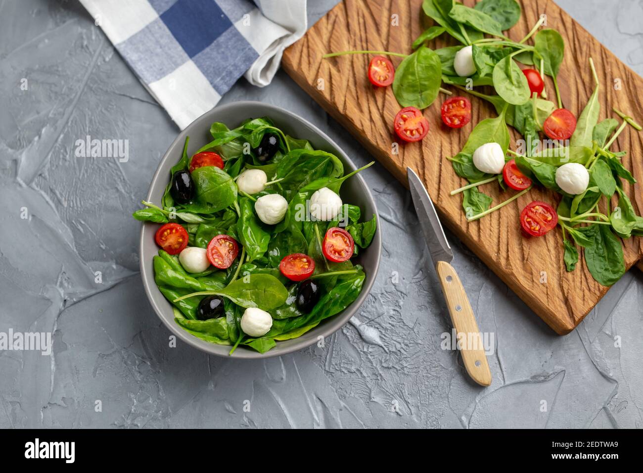 Fresh salad with mozzarella cheese, tomato and spinach. Healthy dieting ...
