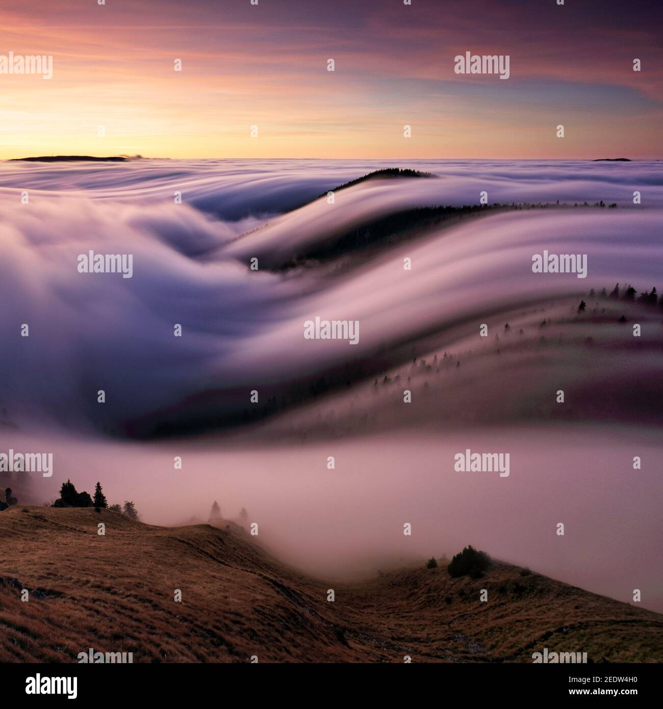 Peak above clouds on sunset hi-res stock photography and images - Alamy