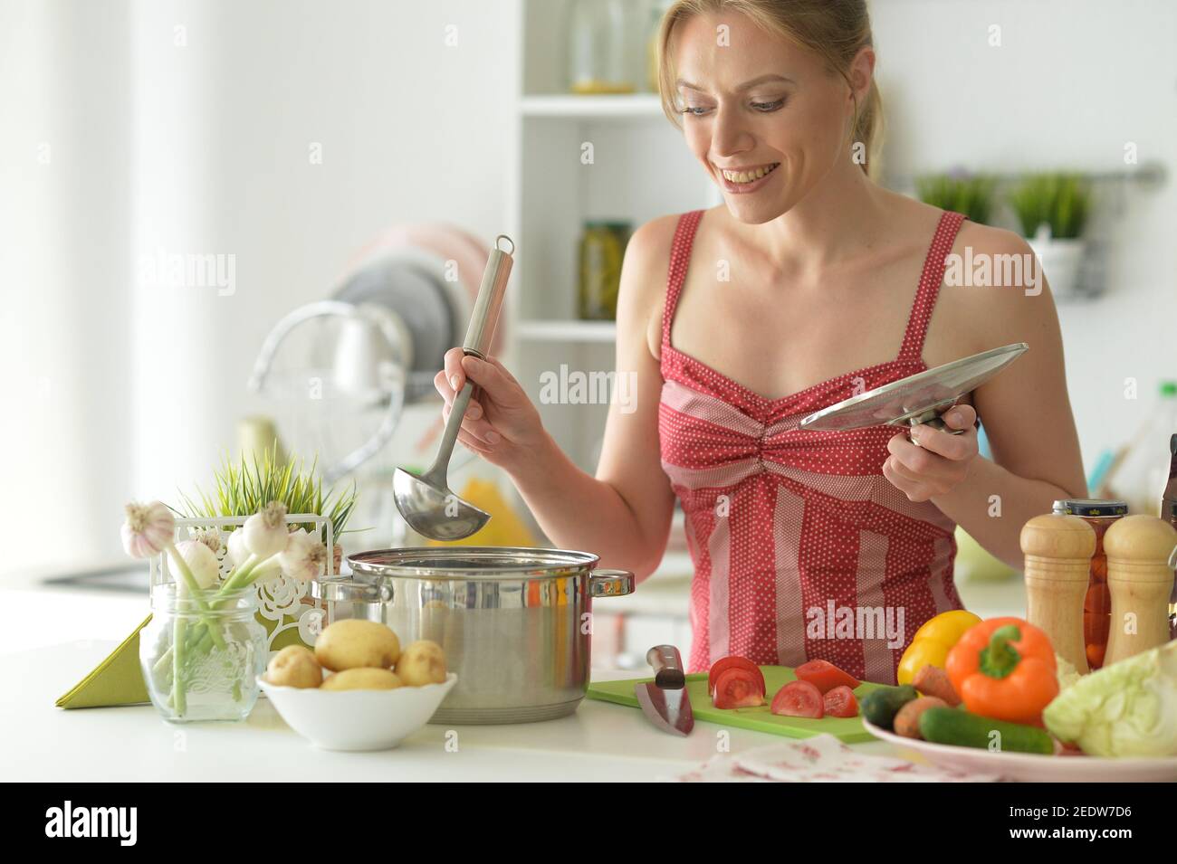 Woman cooking soup beautiful hi-res stock photography and images - Alamy