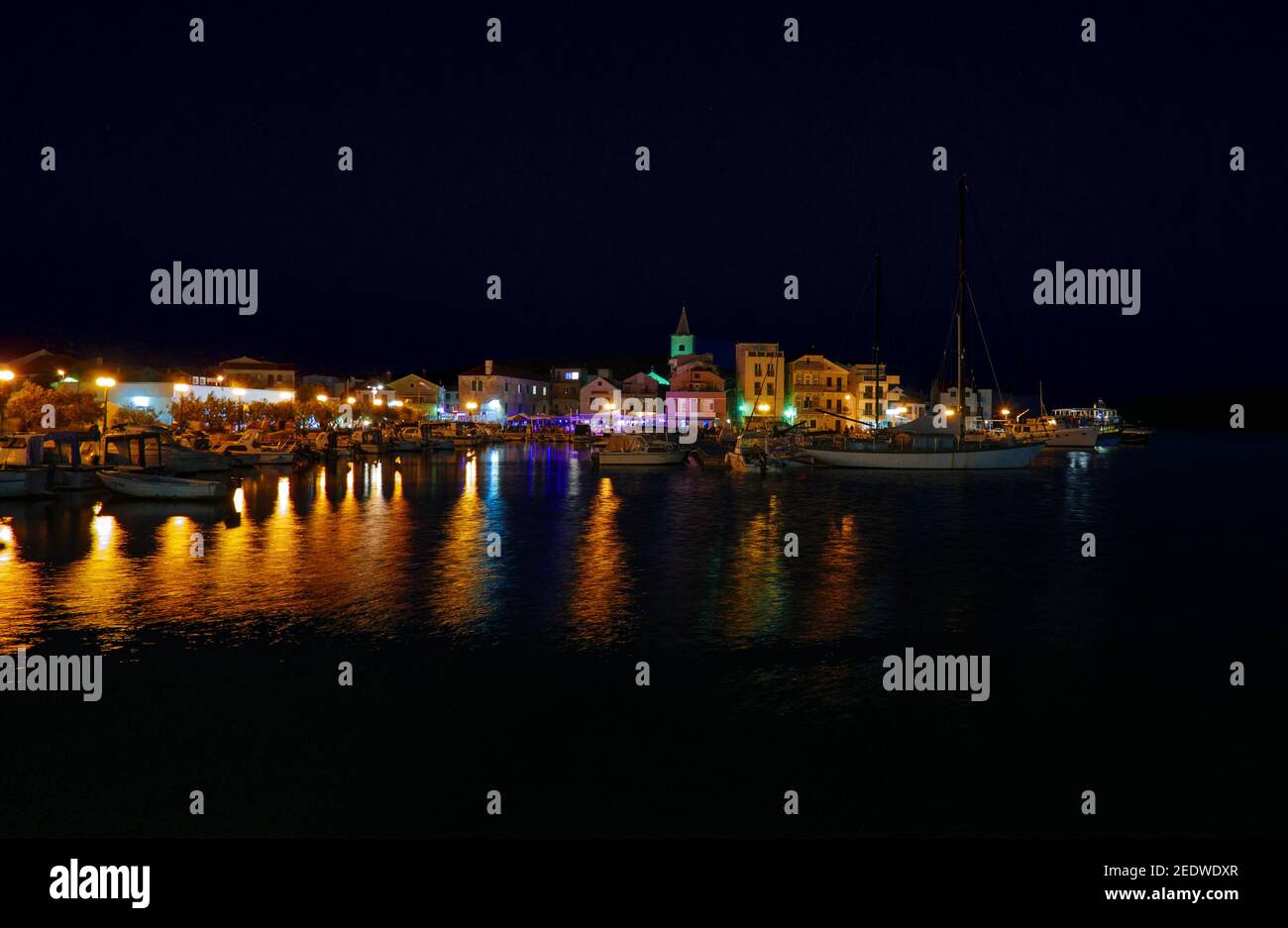 Night image of coastal town. Lights, sea reflection. Pirovac, Croatia ...