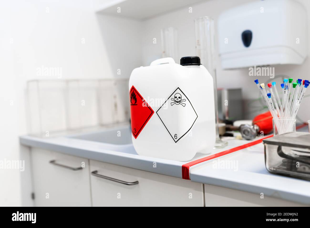 White plastic container for chemical waste from a laboratory ...