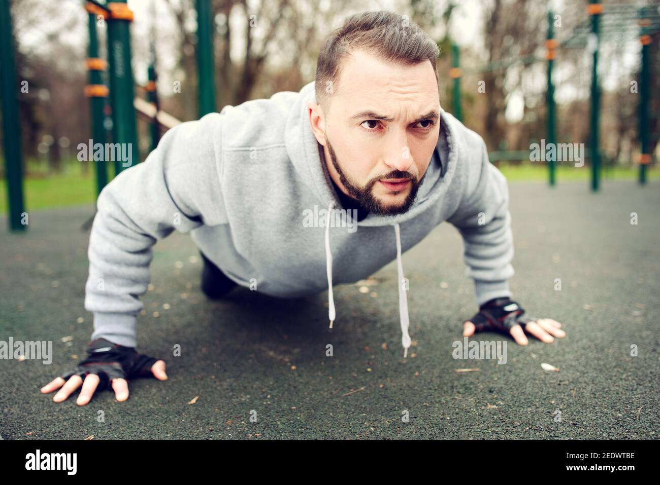 Handsome male runner doing push ups hi-res stock photography and images ...