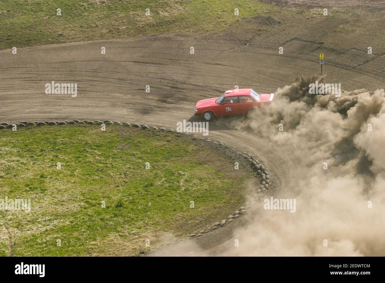 Rally car on a slide in a curve on a dusty racing track Stock Photo - Alamy