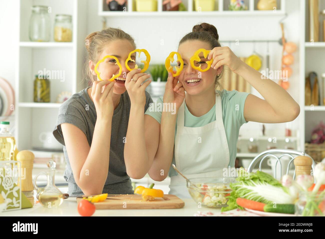 Teenagers cooking with vegetables hi-res stock photography and images ...