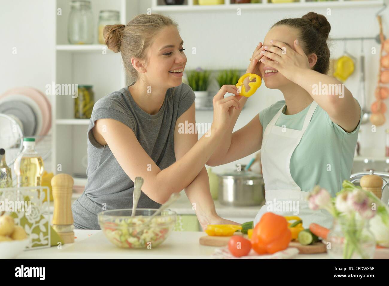 Teenagers cooking with vegetables hi-res stock photography and images ...