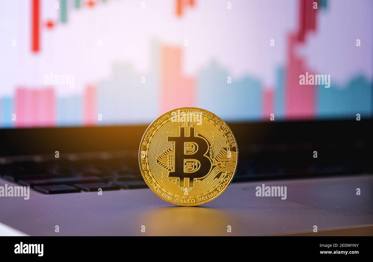 Bitcoin on mining screen and trading chart hi-res stock photography and ...