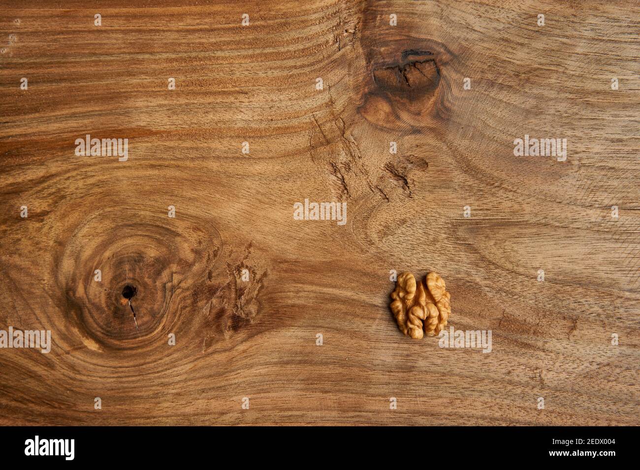 Dry walnut kernels on a walnut wood board Stock Photo - Alamy