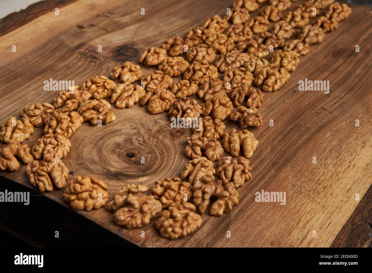 Dry walnut kernels on a walnut wood board Stock Photo - Alamy