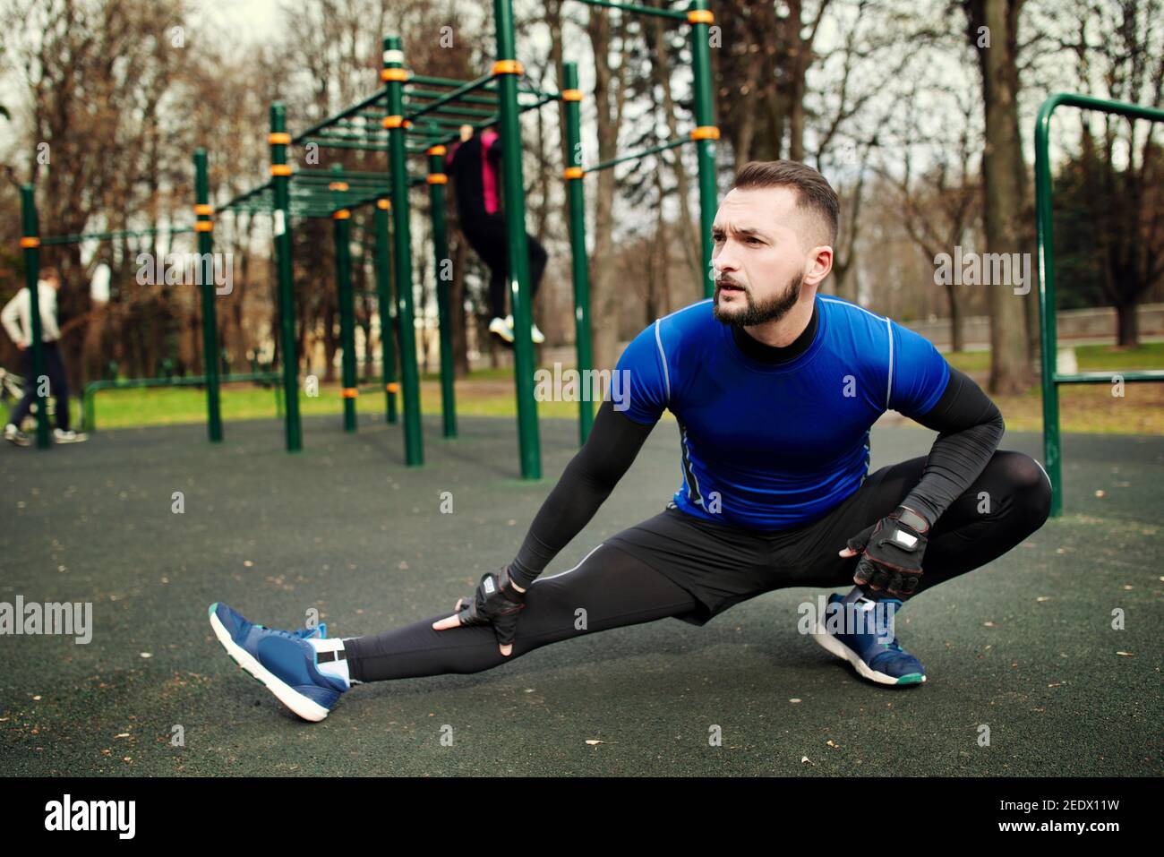 Young strong man stretches his muscles before training Stock Photo - Alamy