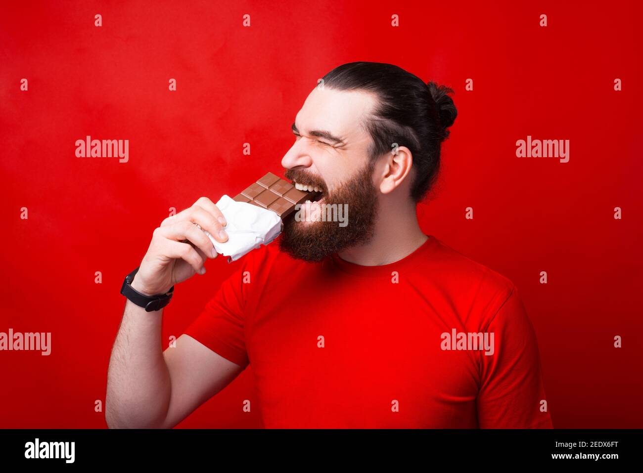Happy fat man eating chocolate hi-res stock photography and images - Alamy