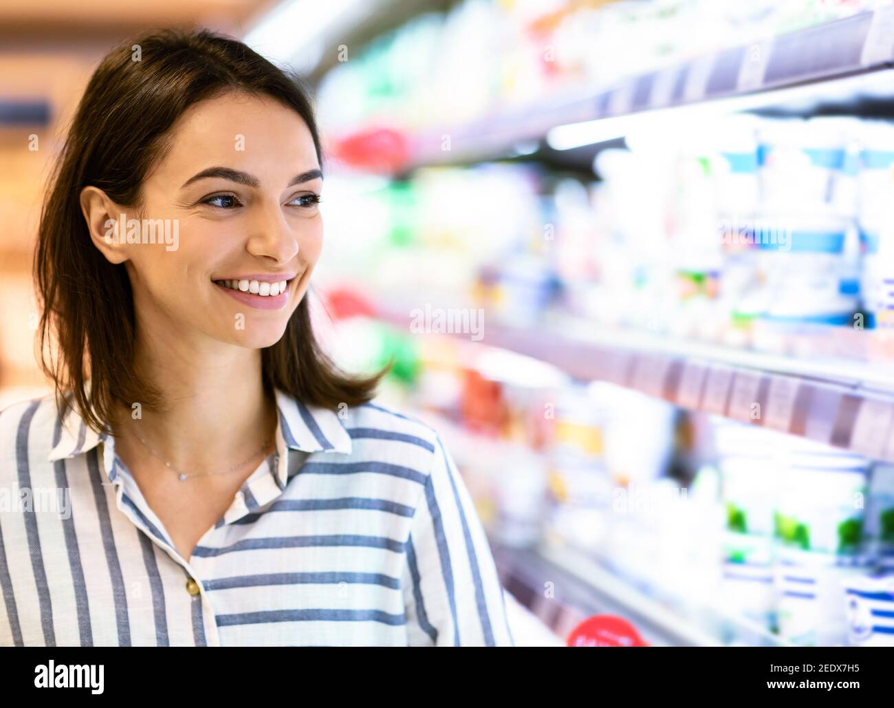 Closeup portrait of woman shopping in supermarket Stock Photo - Alamy