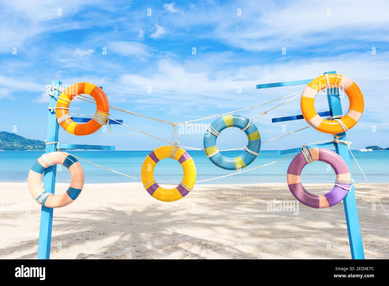 Artificial swim ring rubber on the beach with blue sky in summer Stock ...