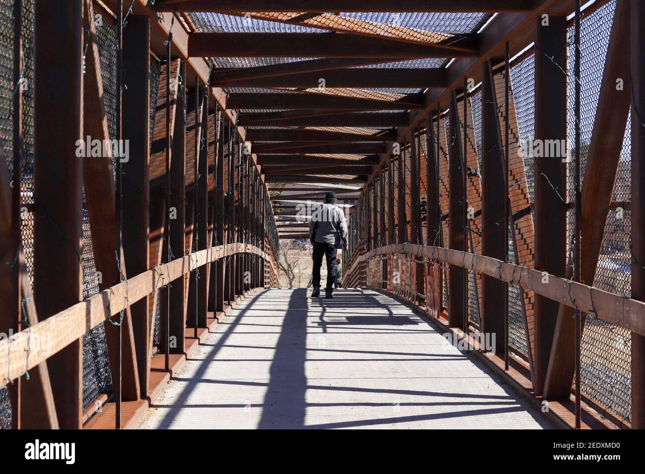 Man walk on a bridge back view hi-res stock photography and images - Alamy