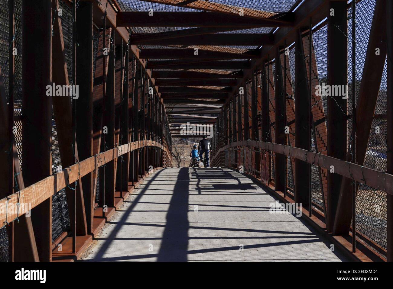 Man walk on a bridge back view hi-res stock photography and images - Alamy